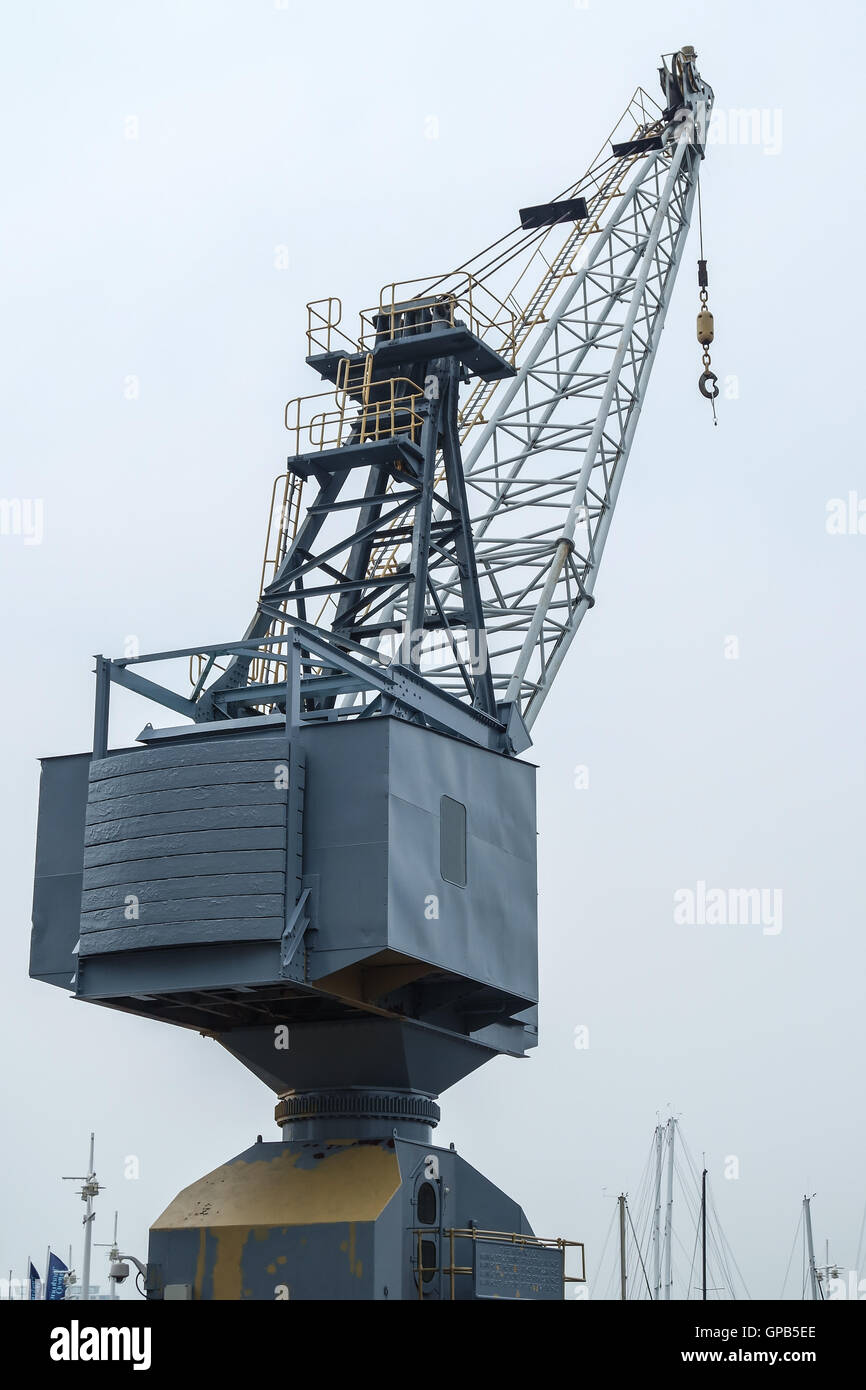A large dock crane used for loading goods on and off ships in dock ...