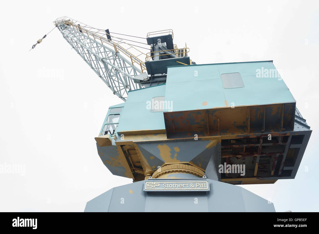 A large dock crane used for loading goods on and off ships in dock ...