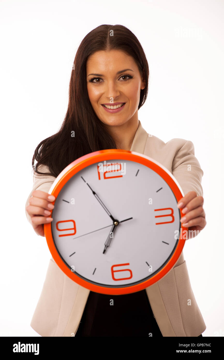 Woman with big clock smiling prepared on time Stock Photo - Alamy