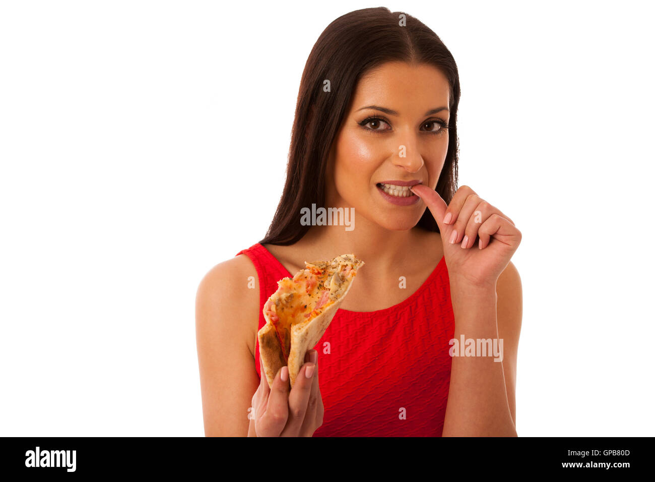 Young woman eating pizza isolated over white background Stock Photo - Alamy