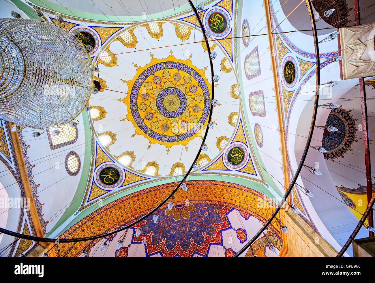 Chandelier and colorful decorated ceiling in the interior of a turkish ...