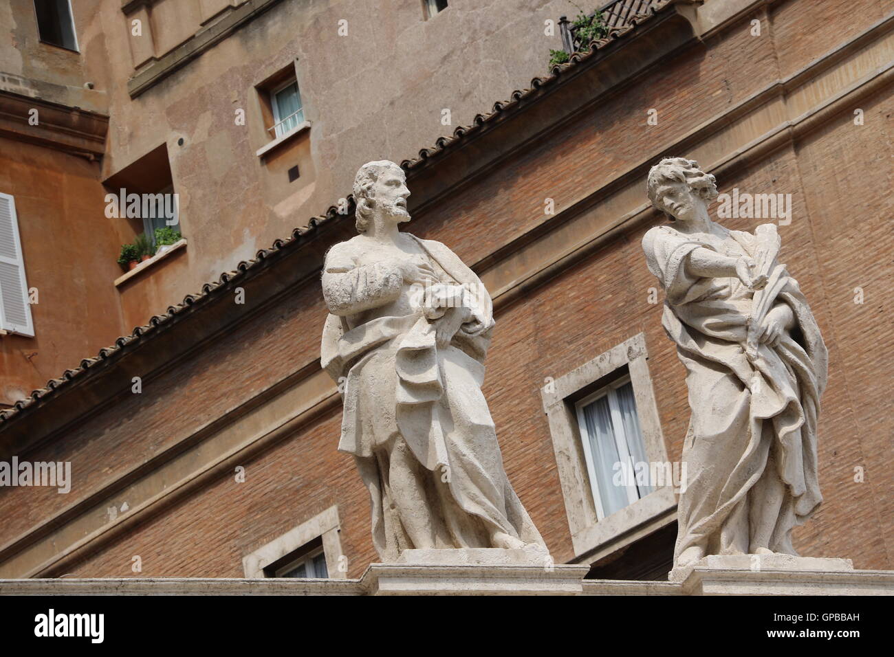 Building and statues near the Papal Basilica of Saint Peter in the ...