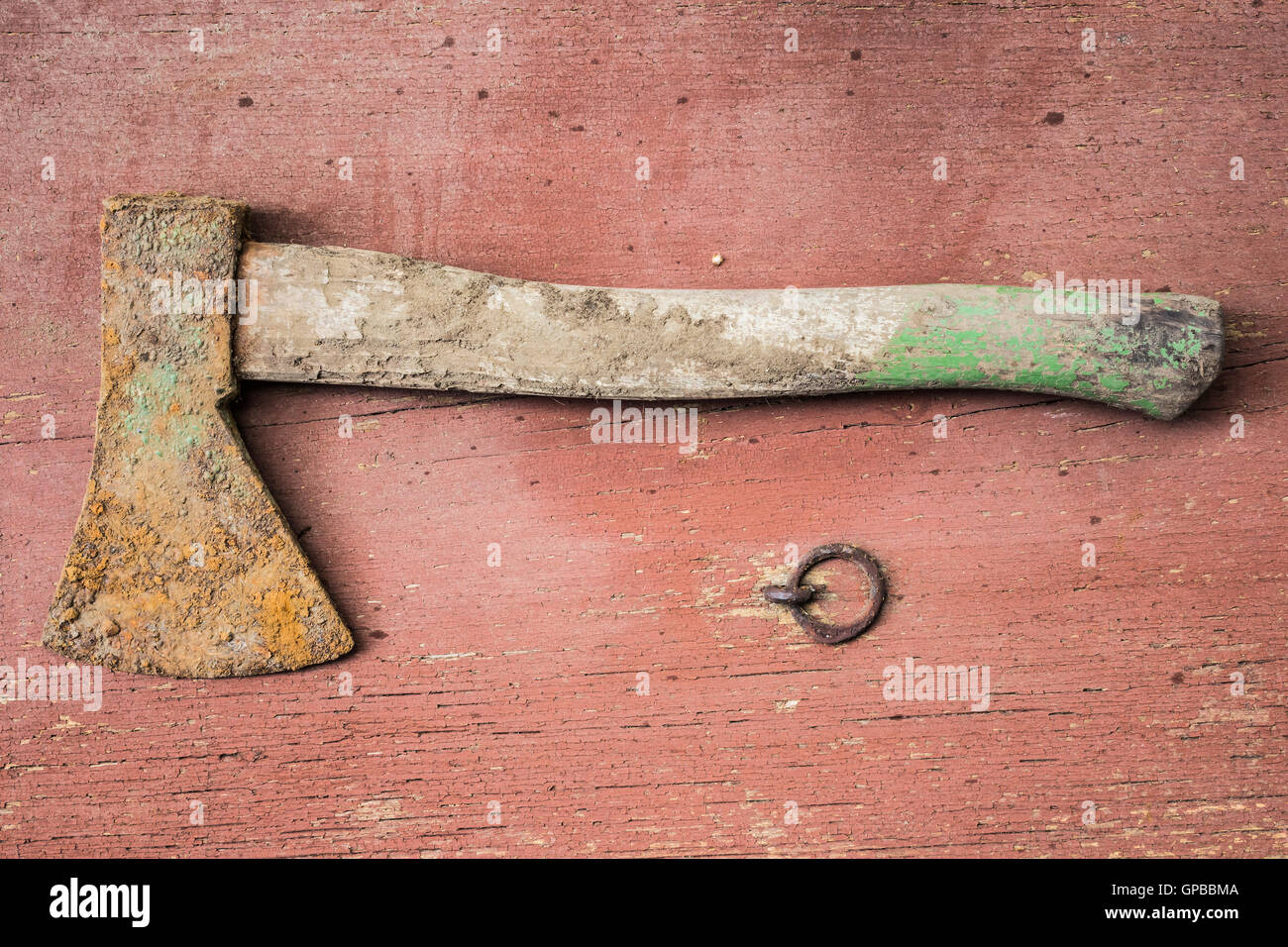rusty axe on a weathered workbench Stock Photo - Alamy
