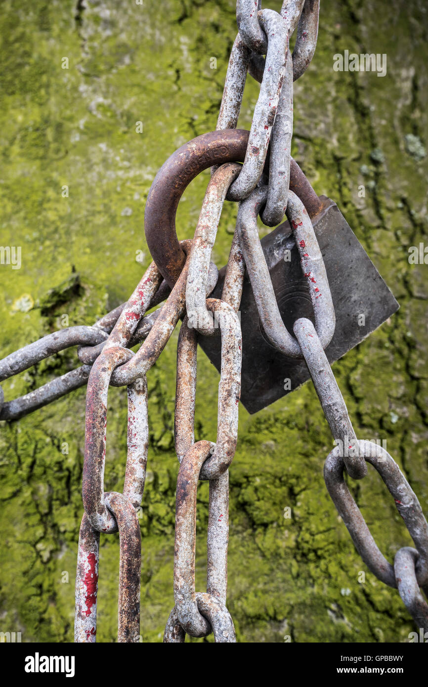 fixing chains with an old padlock Stock Photo - Alamy