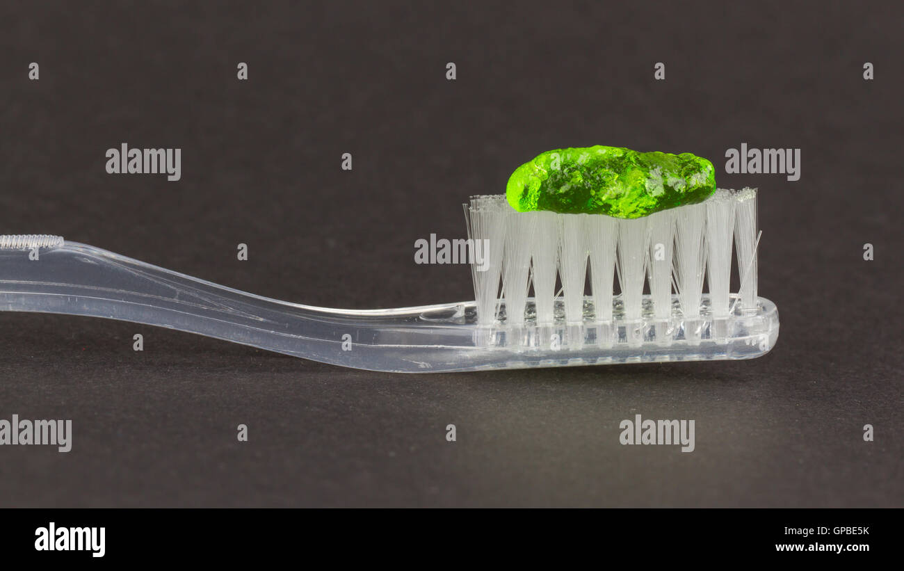 Toothbrush and green toothpaste isolated Stock Photo - Alamy