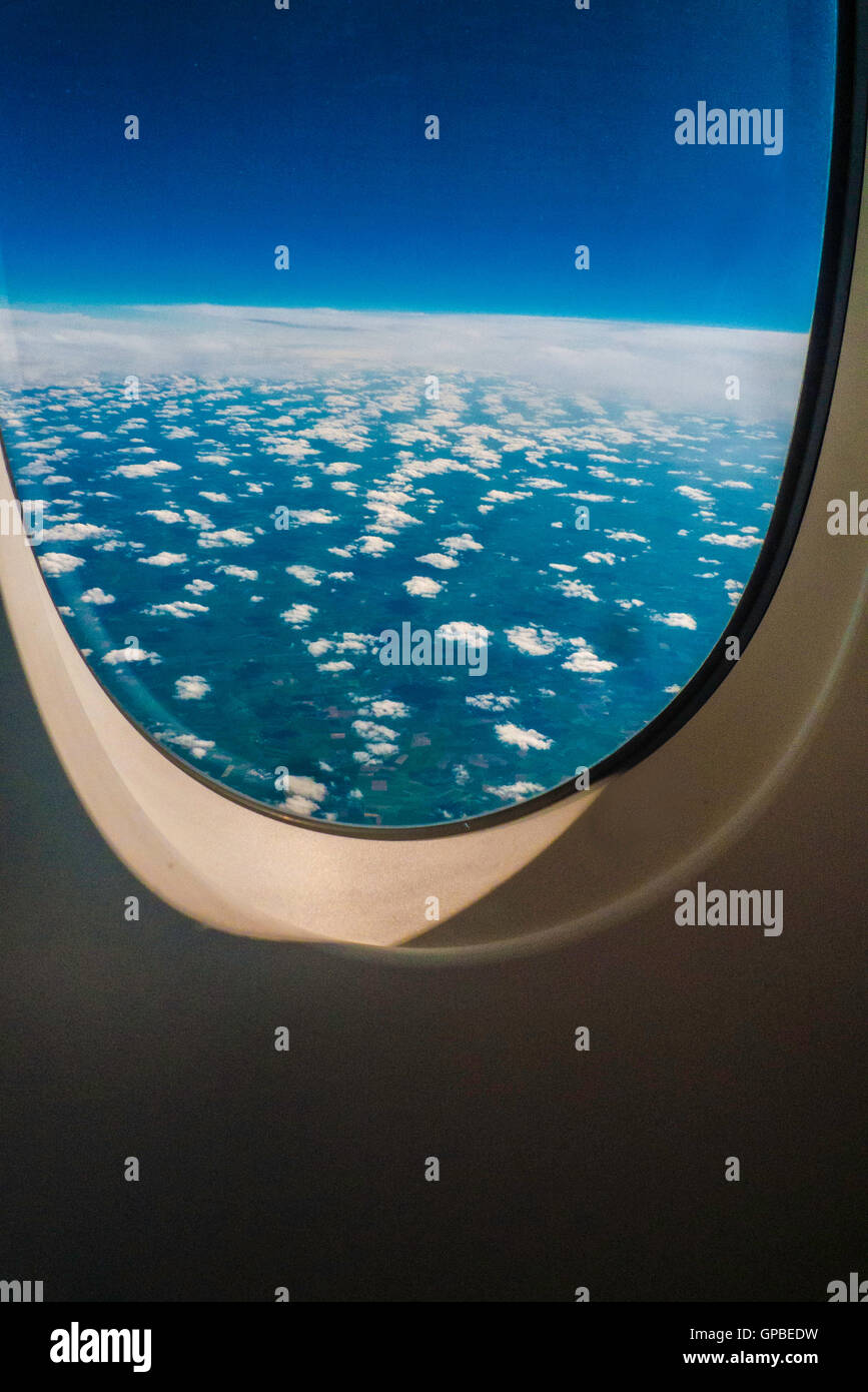 Airplane window showing sky and clouds Stock Photo - Alamy