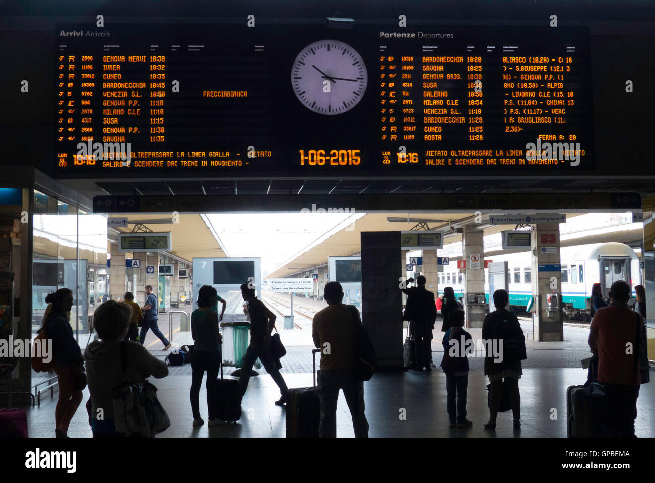 passengers at train station,waiting for information time of departure ...