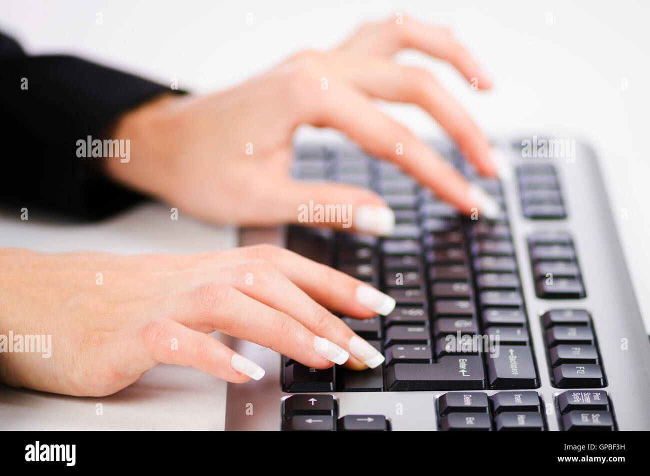 Hands working on the keyboard Stock Photo - Alamy