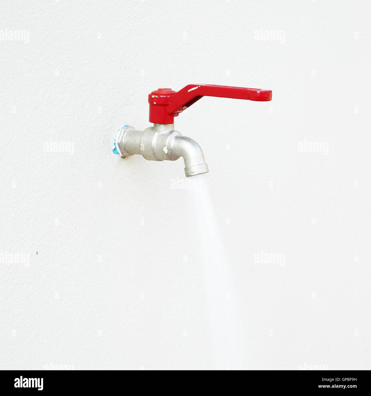 Water valve open on the wall Stock Photo - Alamy