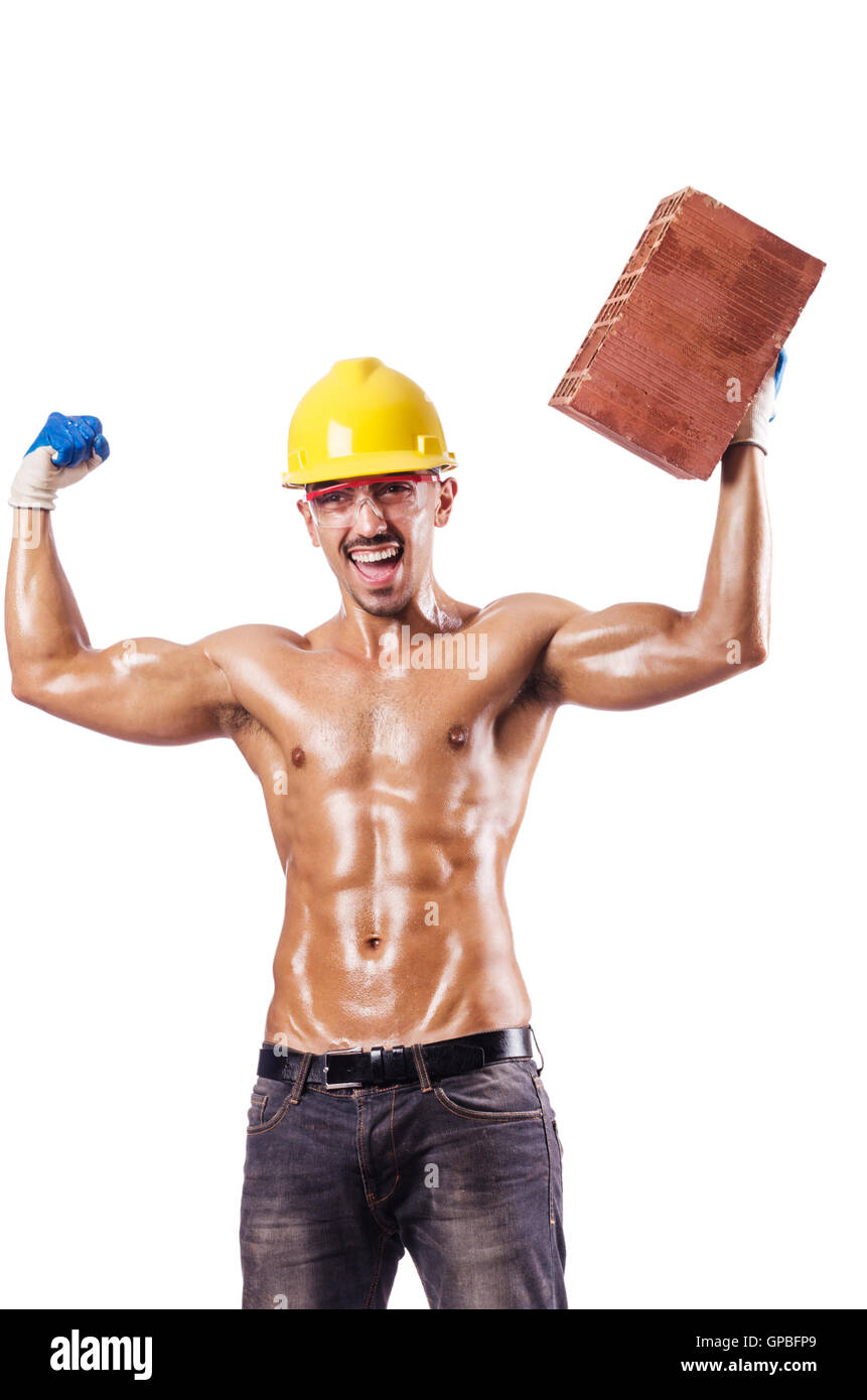 Muscular builder with bricks on white Stock Photo - Alamy