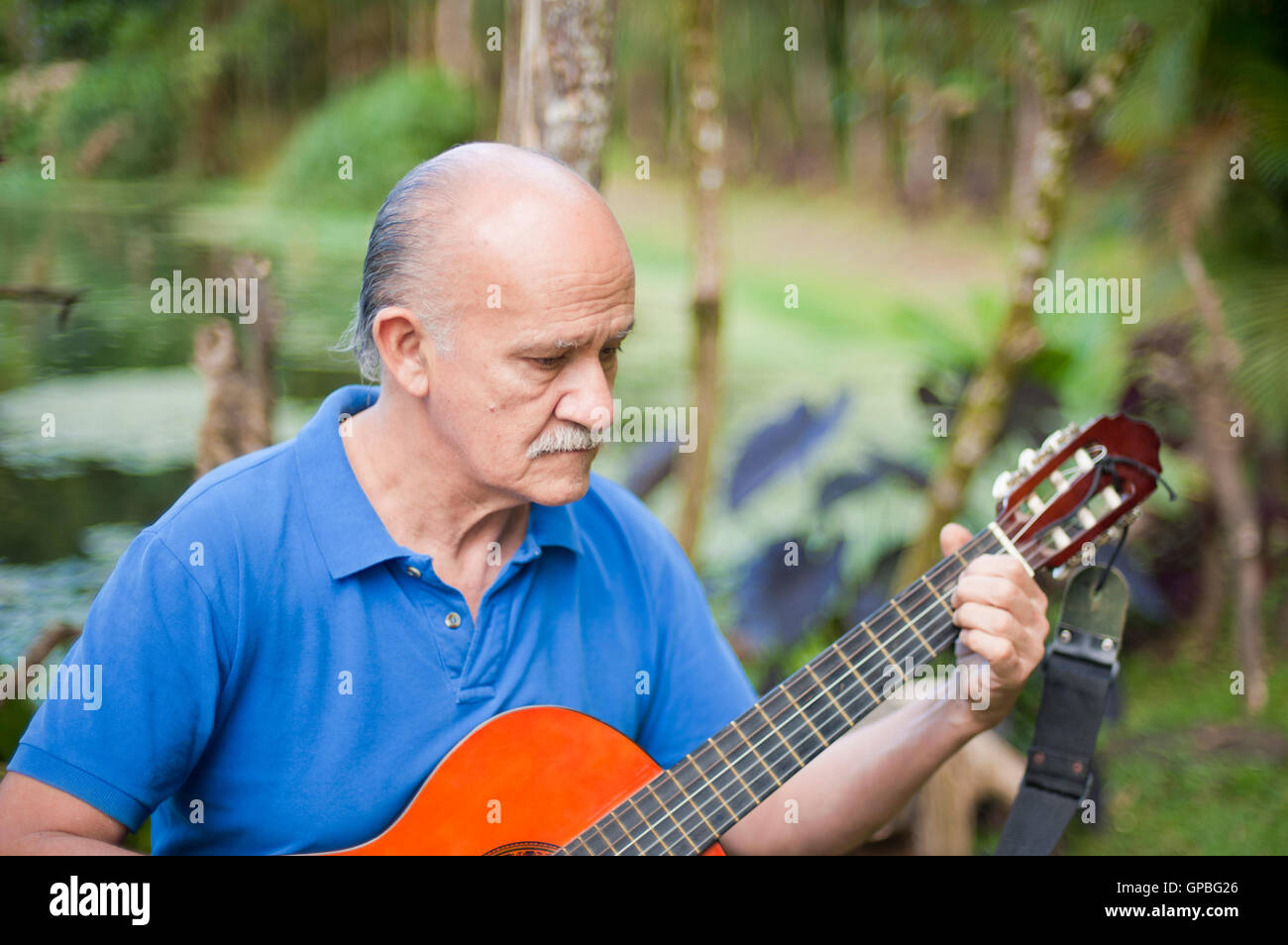 Latin Guitar Player Stock Photo - Alamy