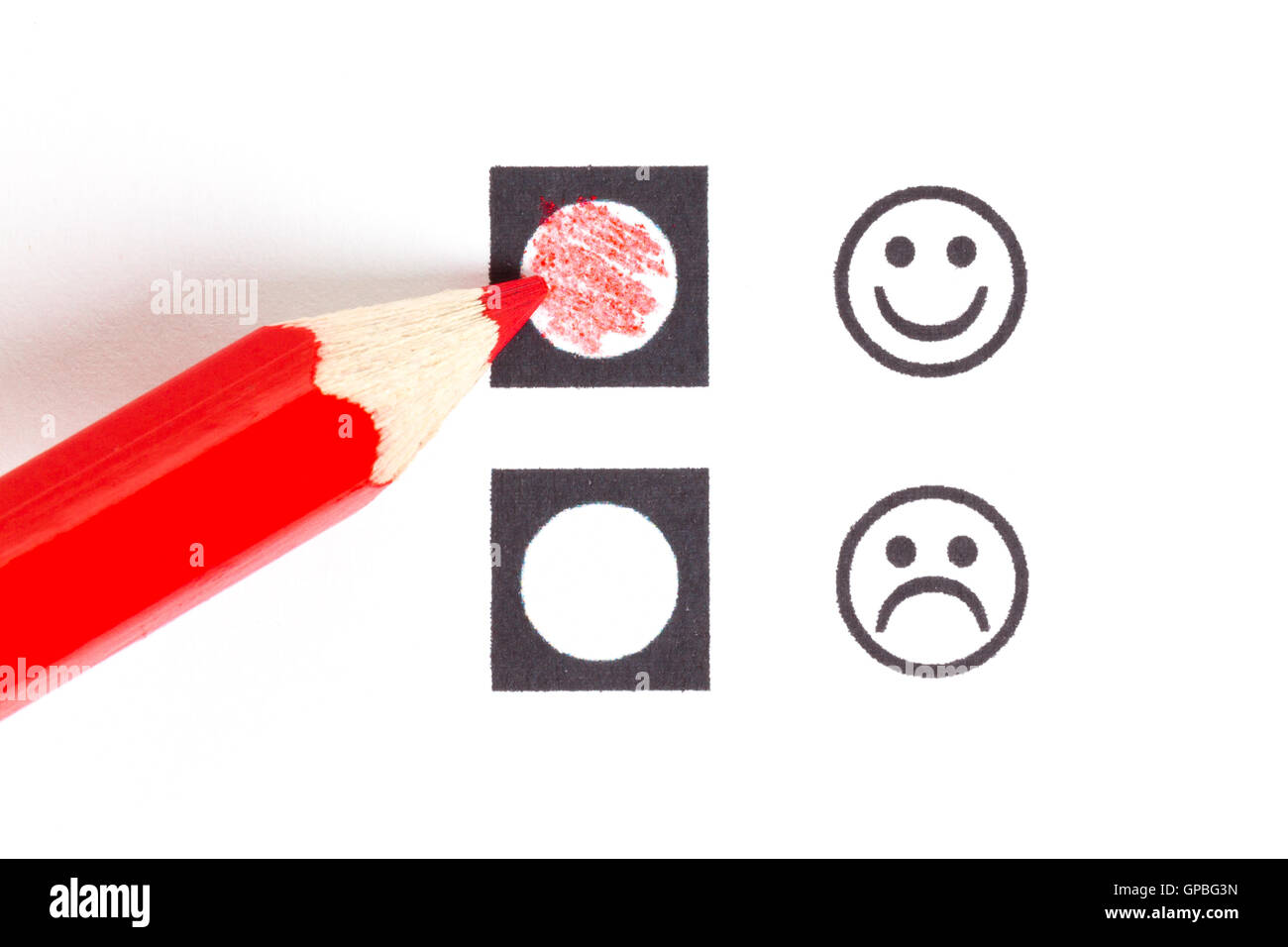 Red pencil choosing the right smiley Stock Photo - Alamy