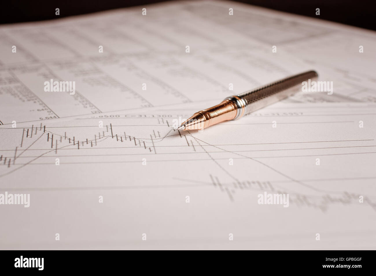 Pen and financial charts Stock Photo - Alamy