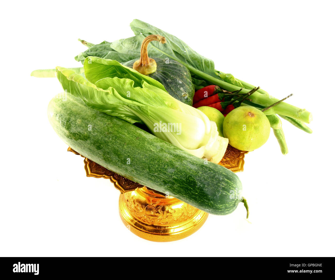 Vegetables mix on golden tray on white background Stock Photo - Alamy