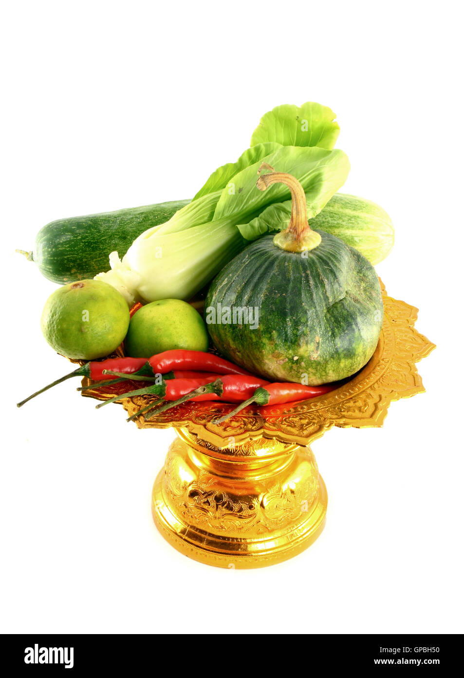 Vegetables mix on golden tray on white background Stock Photo - Alamy