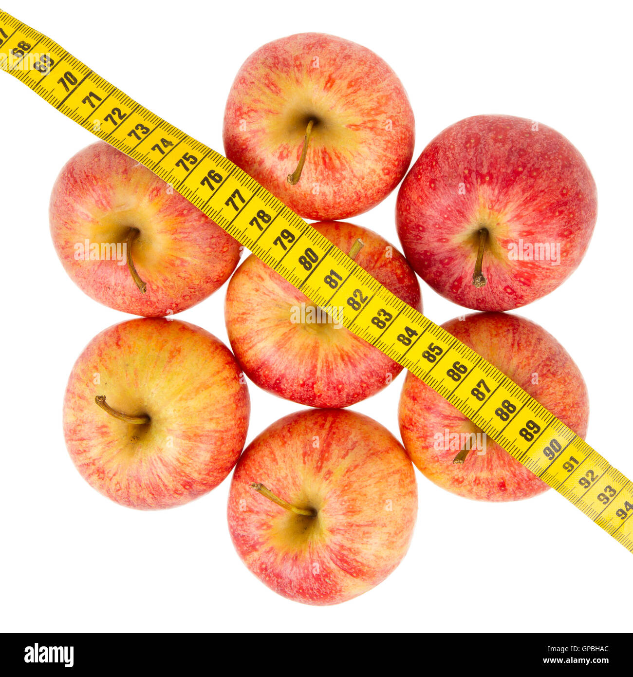 Red apples with a yellow tape-measure Stock Photo - Alamy