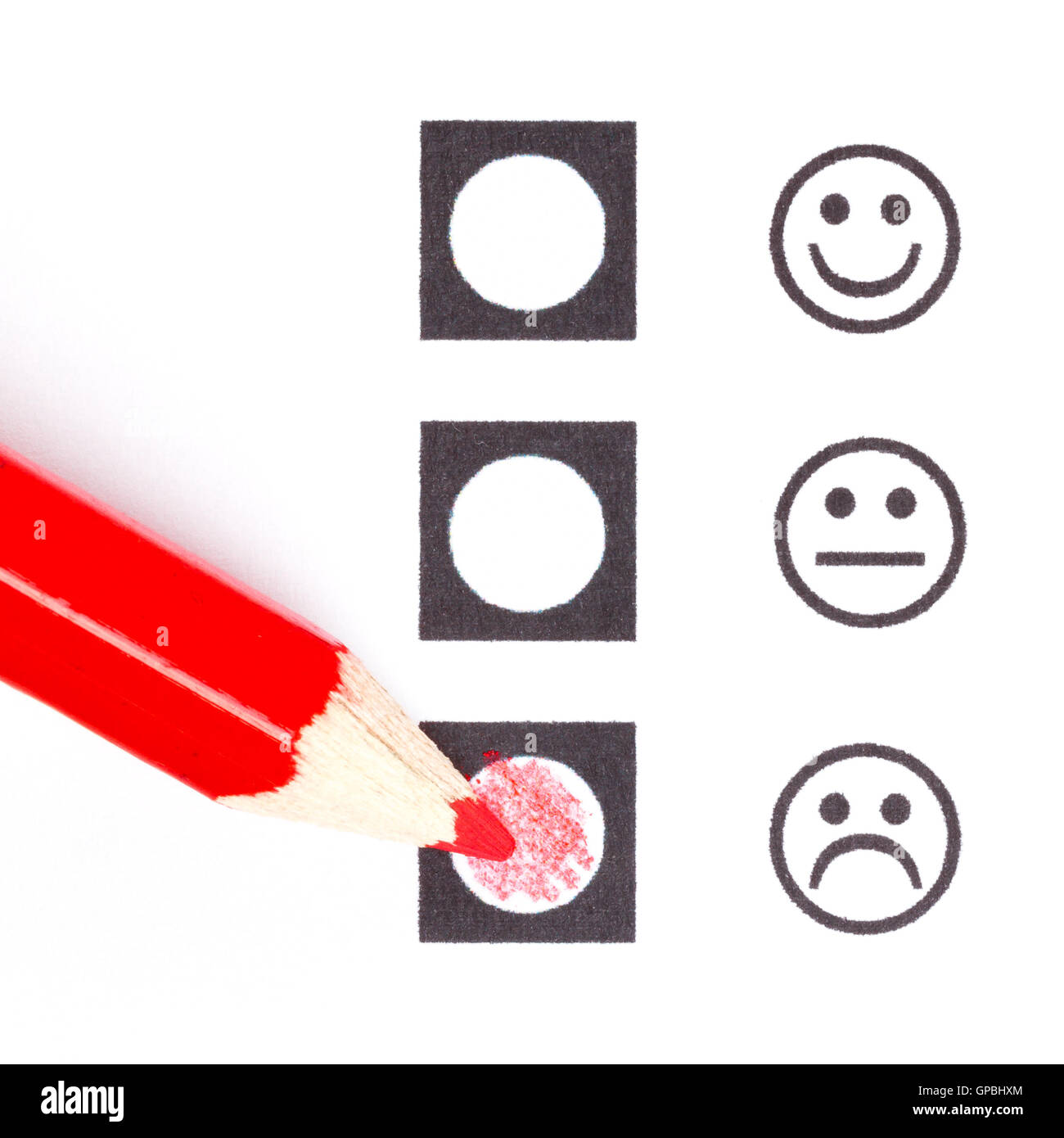 Red pencil choosing the right smiley Stock Photo - Alamy
