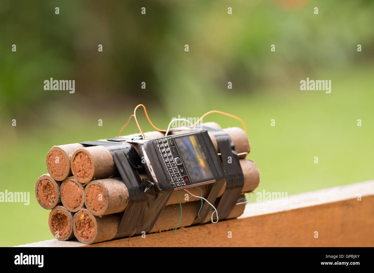 Homemade bomb with explosives and cellular phone attached wires sitting ...