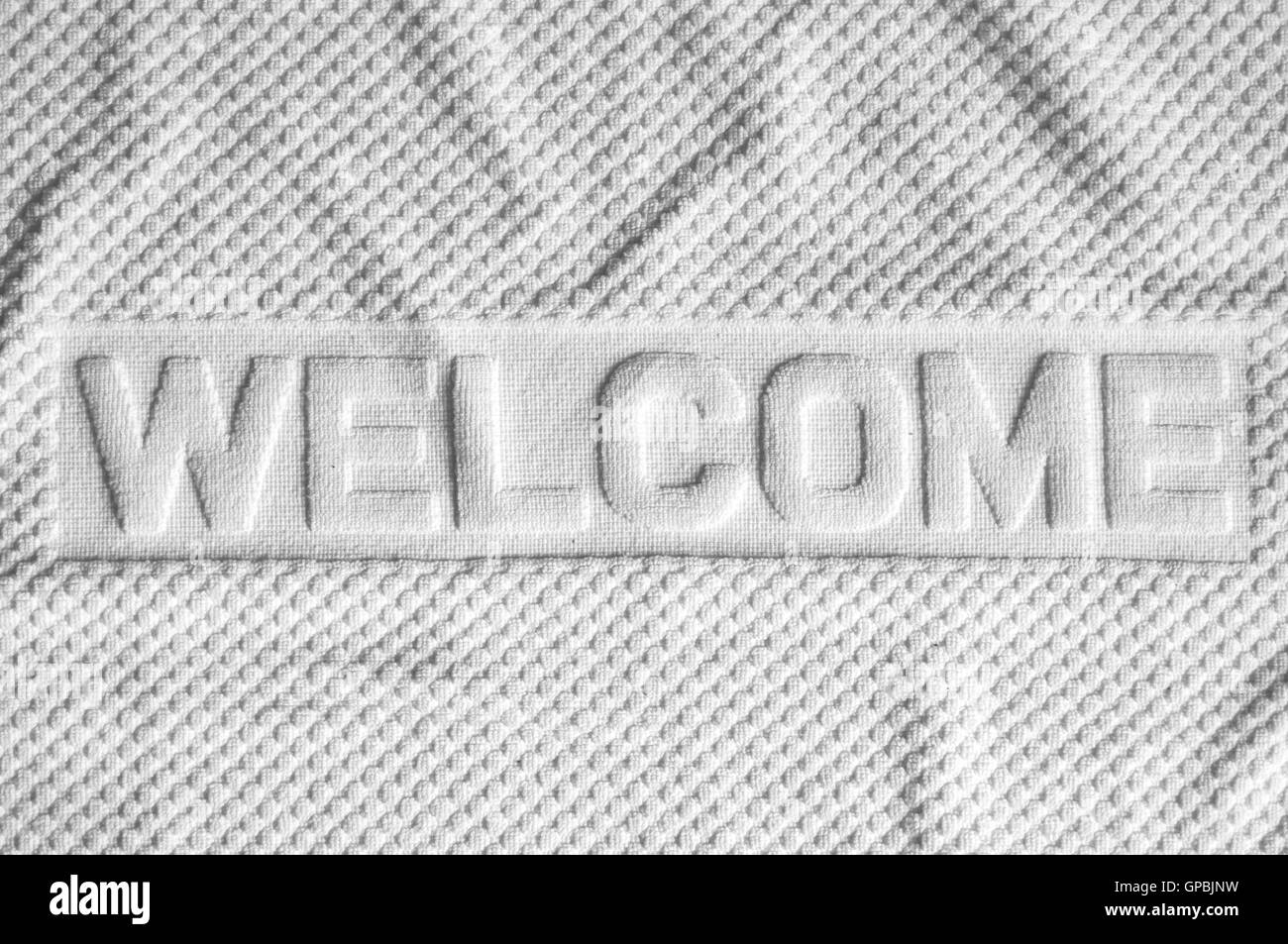 White welcome mat Stock Photo - Alamy