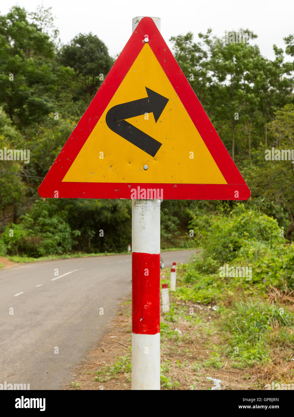 Bending roadtraffic sign Stock Photo - Alamy