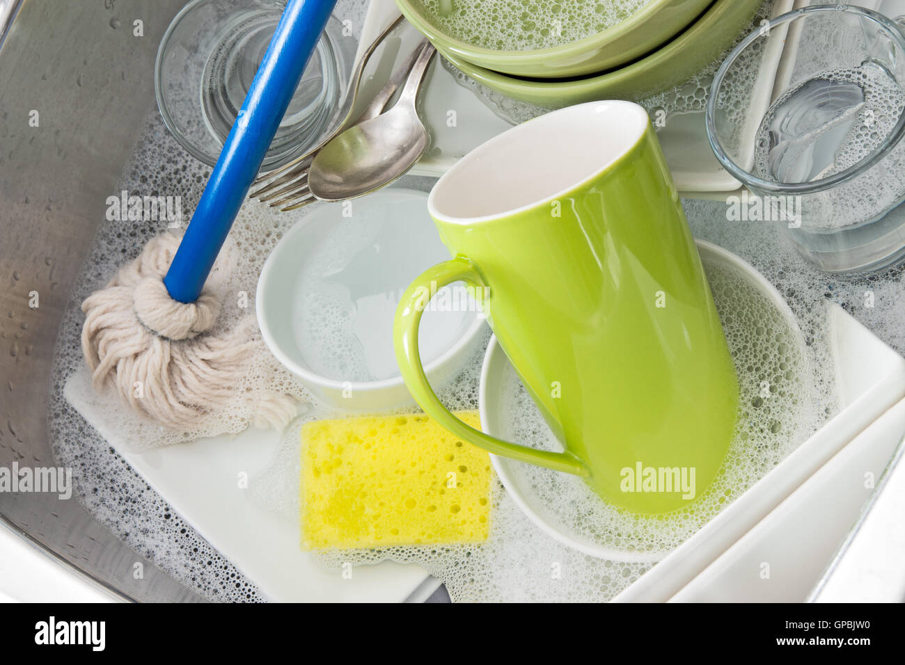 Washing bright dishes Stock Photo - Alamy