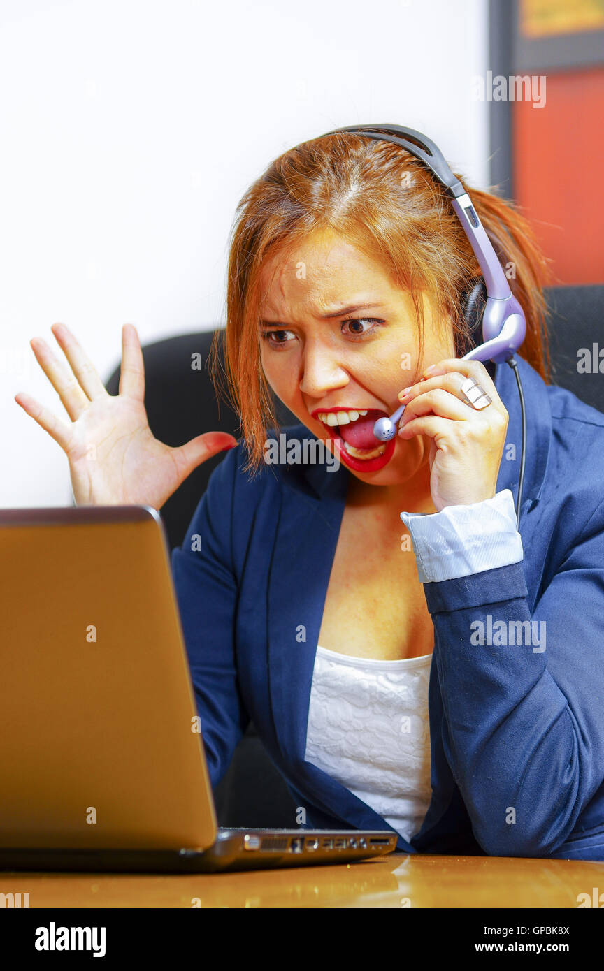 Young attractive woman wearing office clothes and headset sitting by ...