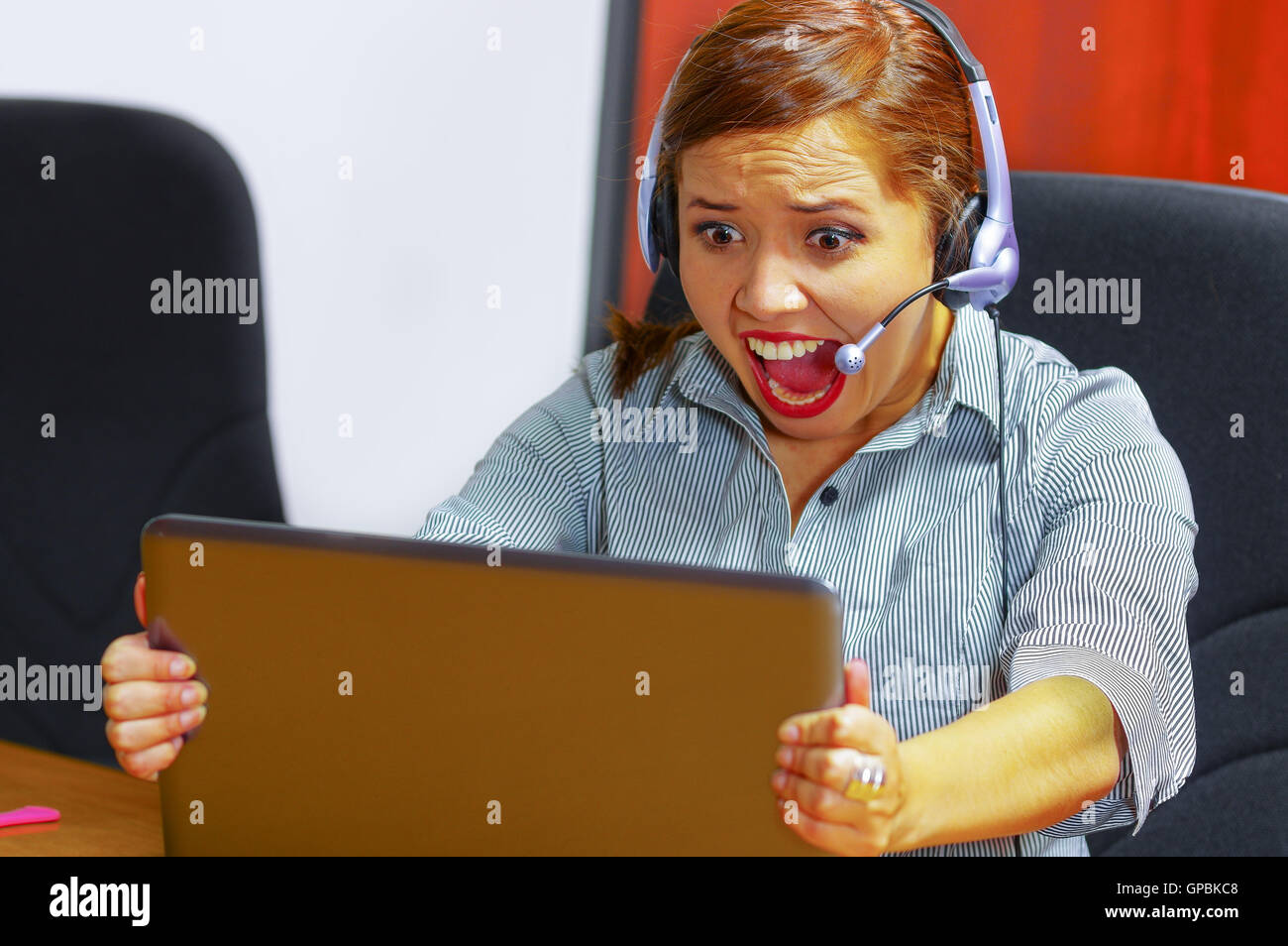 Young attractive woman wearing office clothes and headset sitting by ...