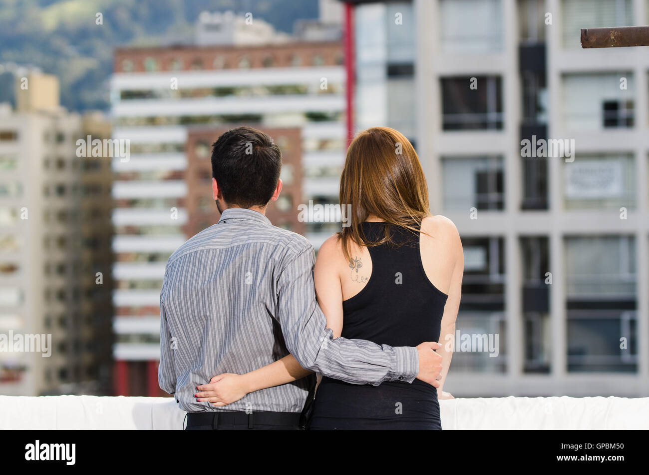 Two people on balcony behind hi-res stock photography and images - Alamy
