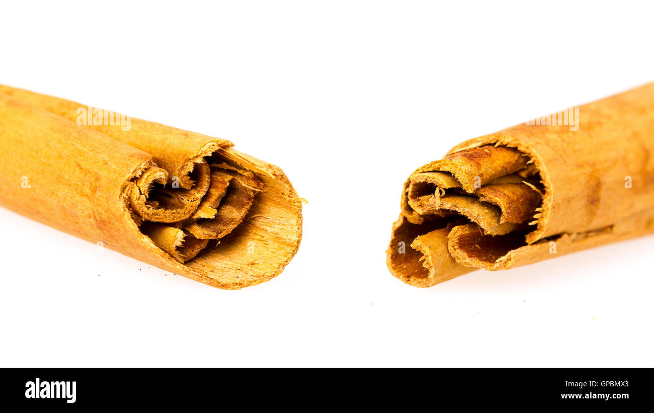 One broken cinnamon stick isolated on white background Stock Photo - Alamy
