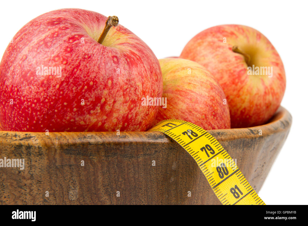 Red apples with a yellow tape-measure Stock Photo - Alamy