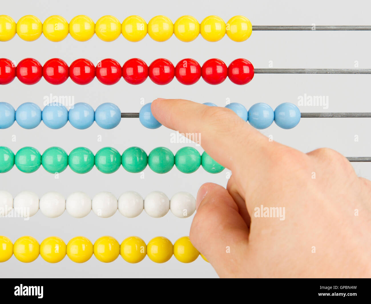 A man using an abacus on a white background Stock Photo - Alamy