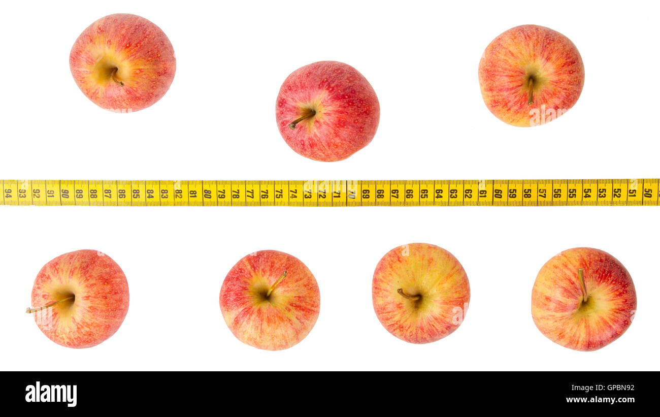 Red apples with a yellow tape measure hi-res stock photography and ...