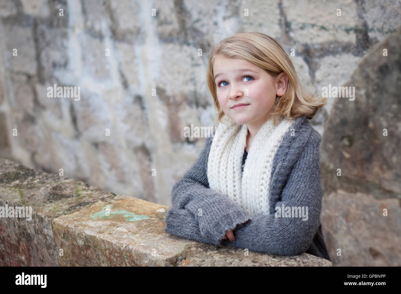 Girl on stone balcony in an old fortress Stock Photo - Alamy