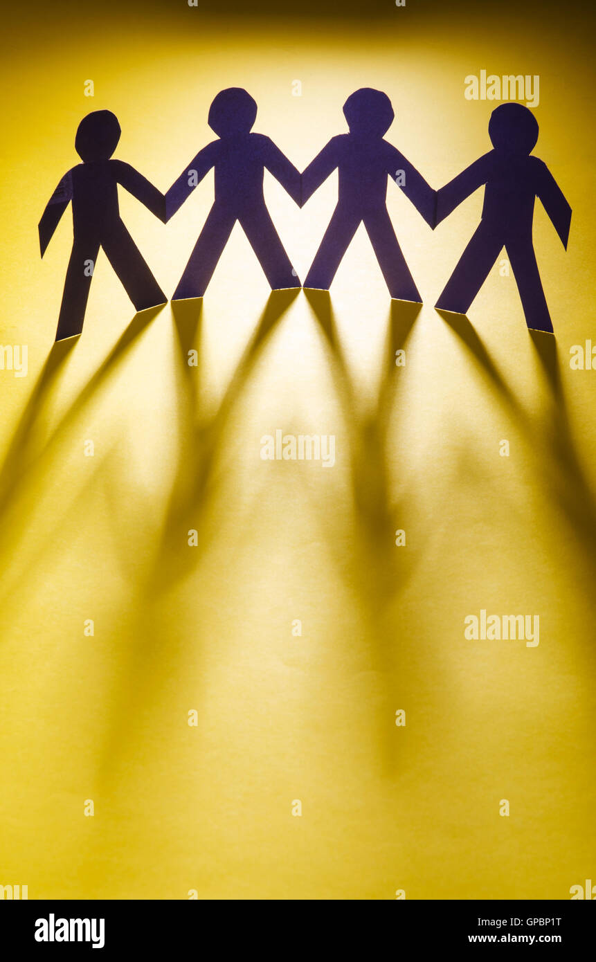 Paper people in teamworking concept Stock Photo - Alamy