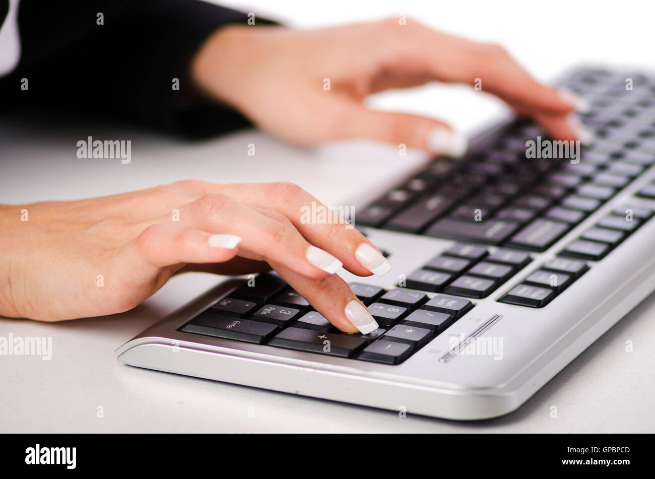 Hands working on the keyboard Stock Photo - Alamy