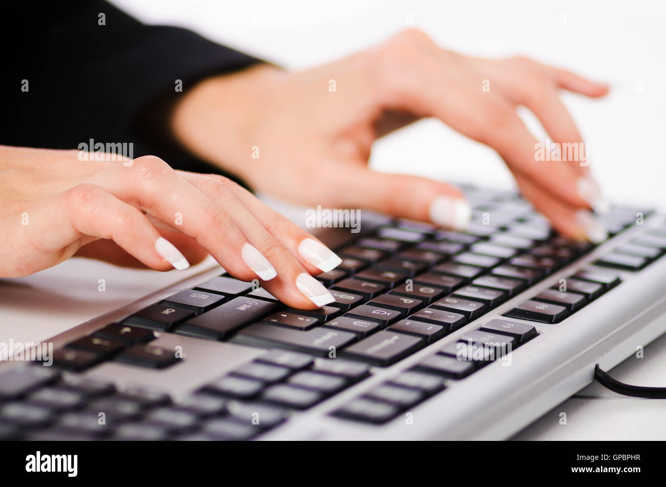 Hands working on the keyboard Stock Photo - Alamy