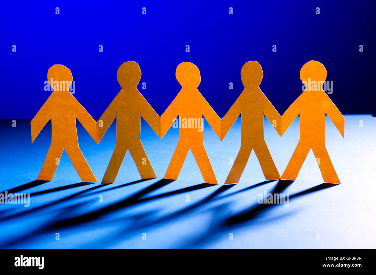 Paper people in teamworking concept Stock Photo - Alamy
