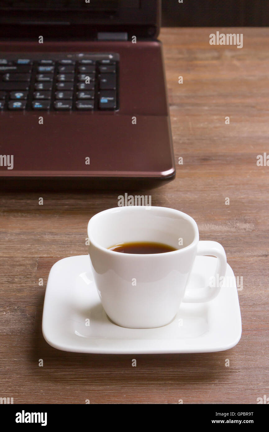 Espresso coffee with laptop Stock Photo - Alamy
