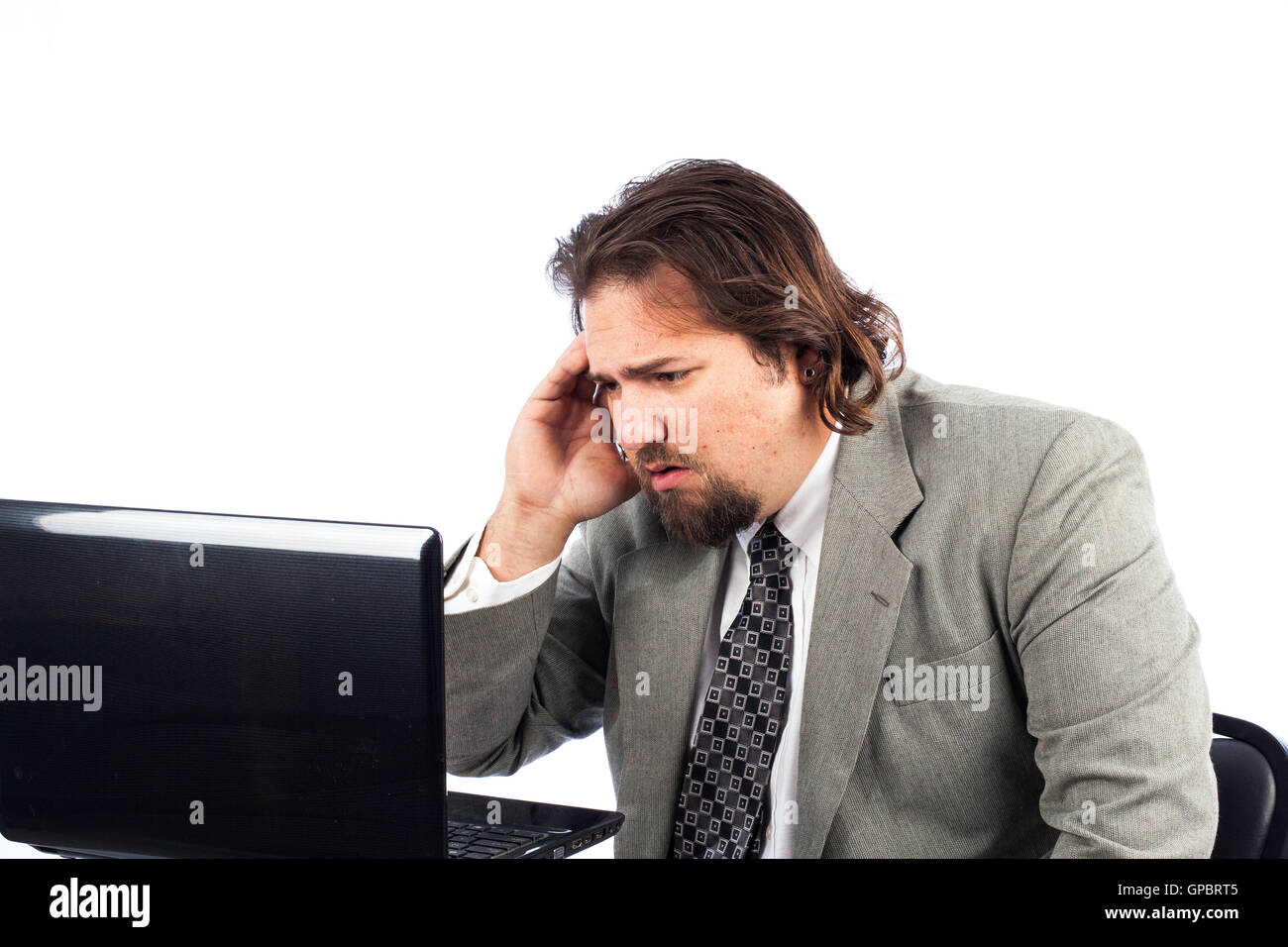 Sad business man on laptop Stock Photo - Alamy