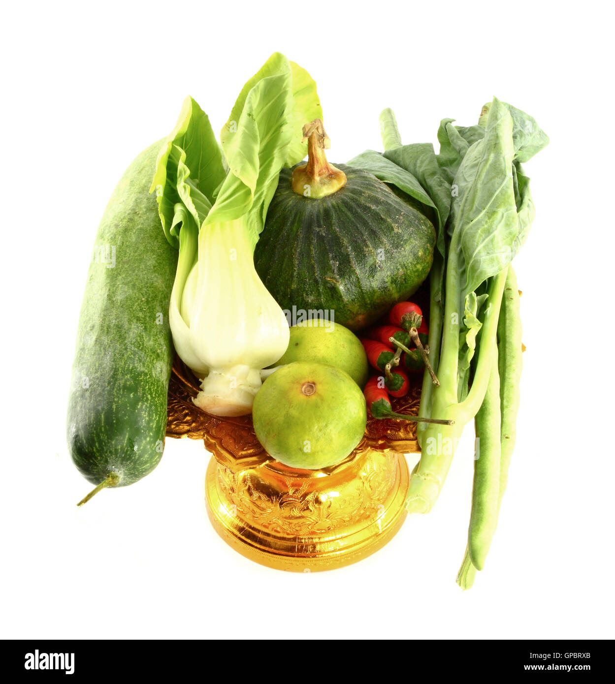 Vegetables mix on golden tray on white background Stock Photo - Alamy