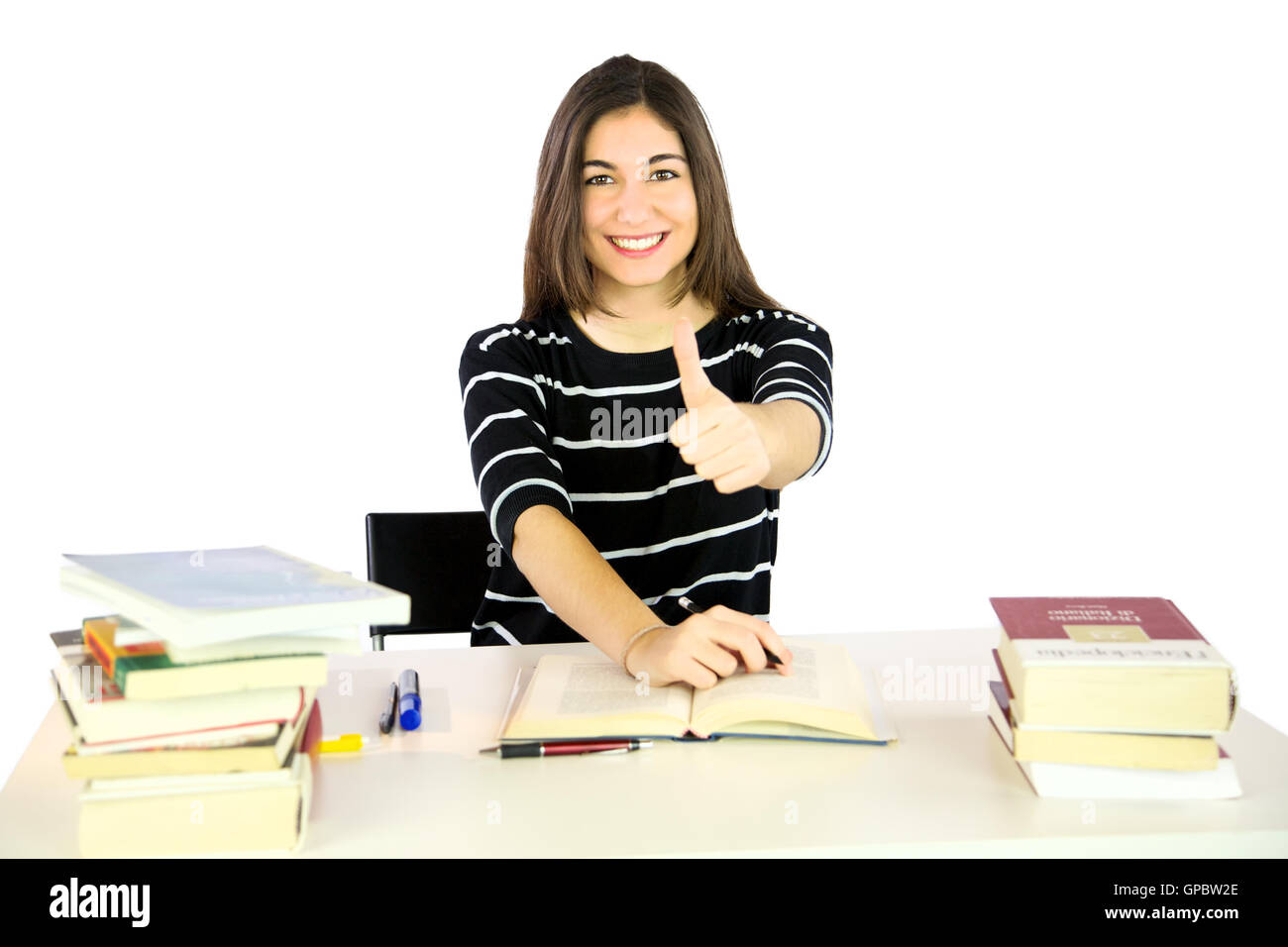 Beautiful student with books thumb up Stock Photo - Alamy