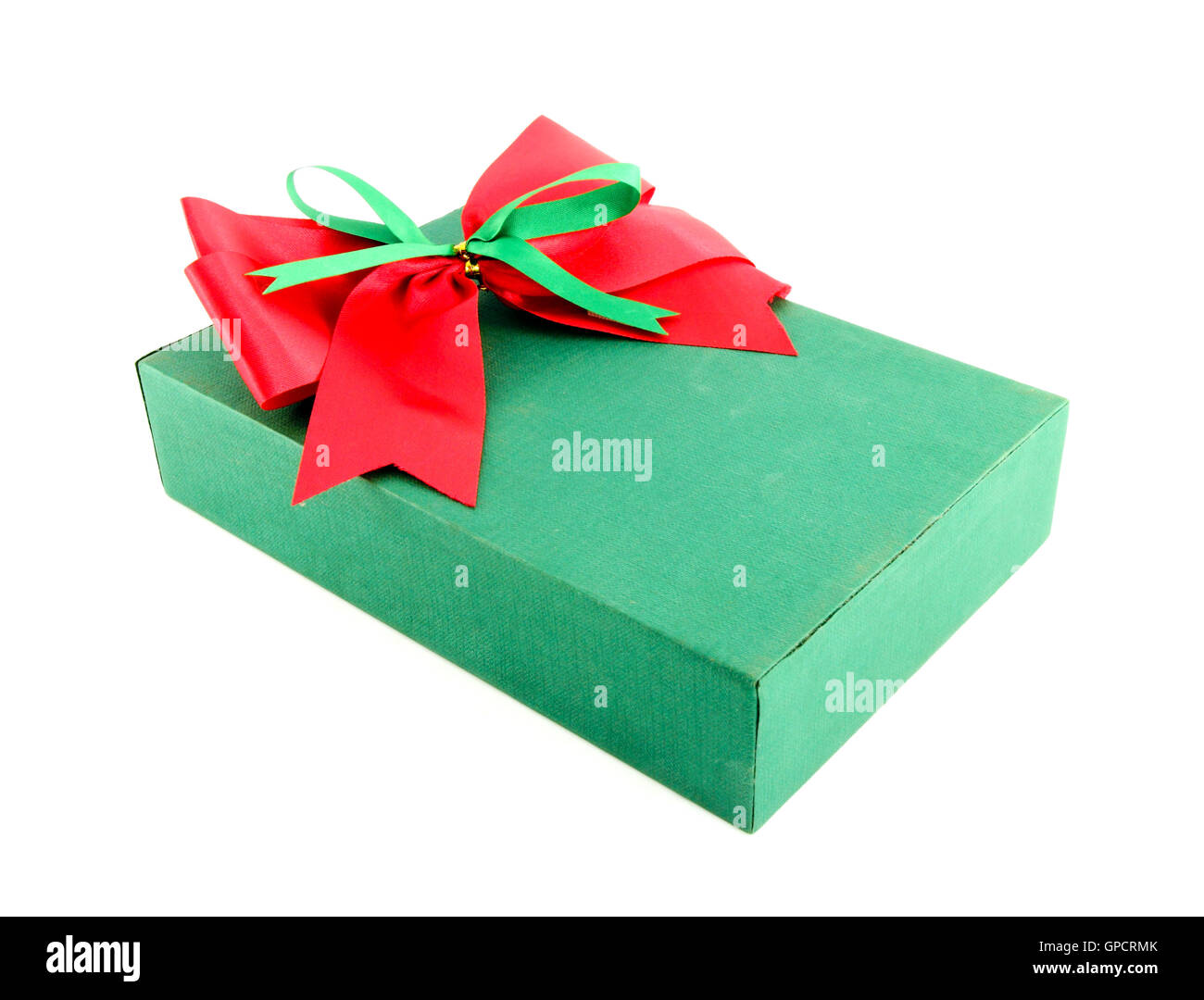 green gift box with red ribbon on white background Stock Photo - Alamy