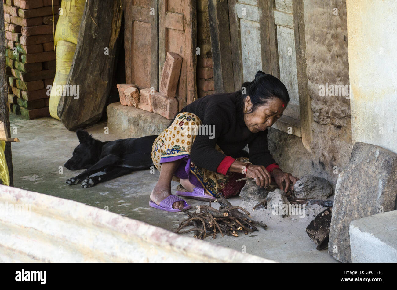 Old woman the fireplace hi-res stock photography and images - Alamy