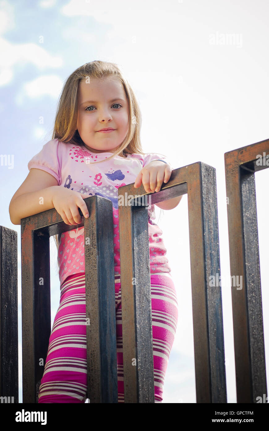 young girl by the railings Stock Photo - Alamy