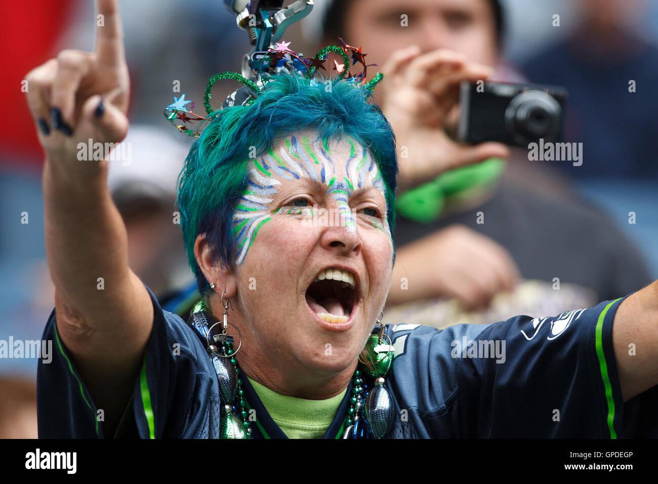 September 12, 2010; Seattle, WA, USA; A Seattle Seahawks fan cheers her ...