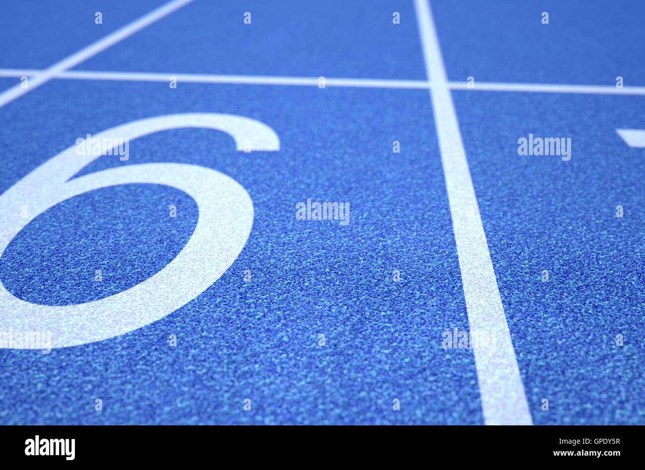 A 3D render of a section of the start line of an blue athletics track ...