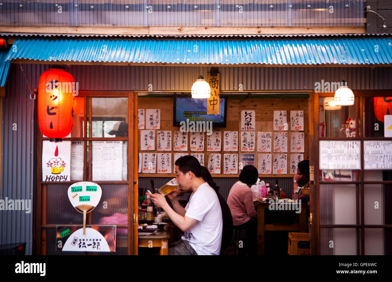 People eat and drink in a restaurant in Tokyo, Japan Stock Photo - Alamy