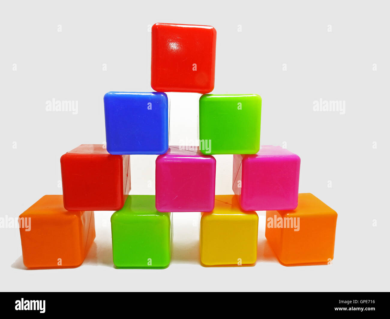 Pyramid built from colored children's blocks Stock Photo - Alamy