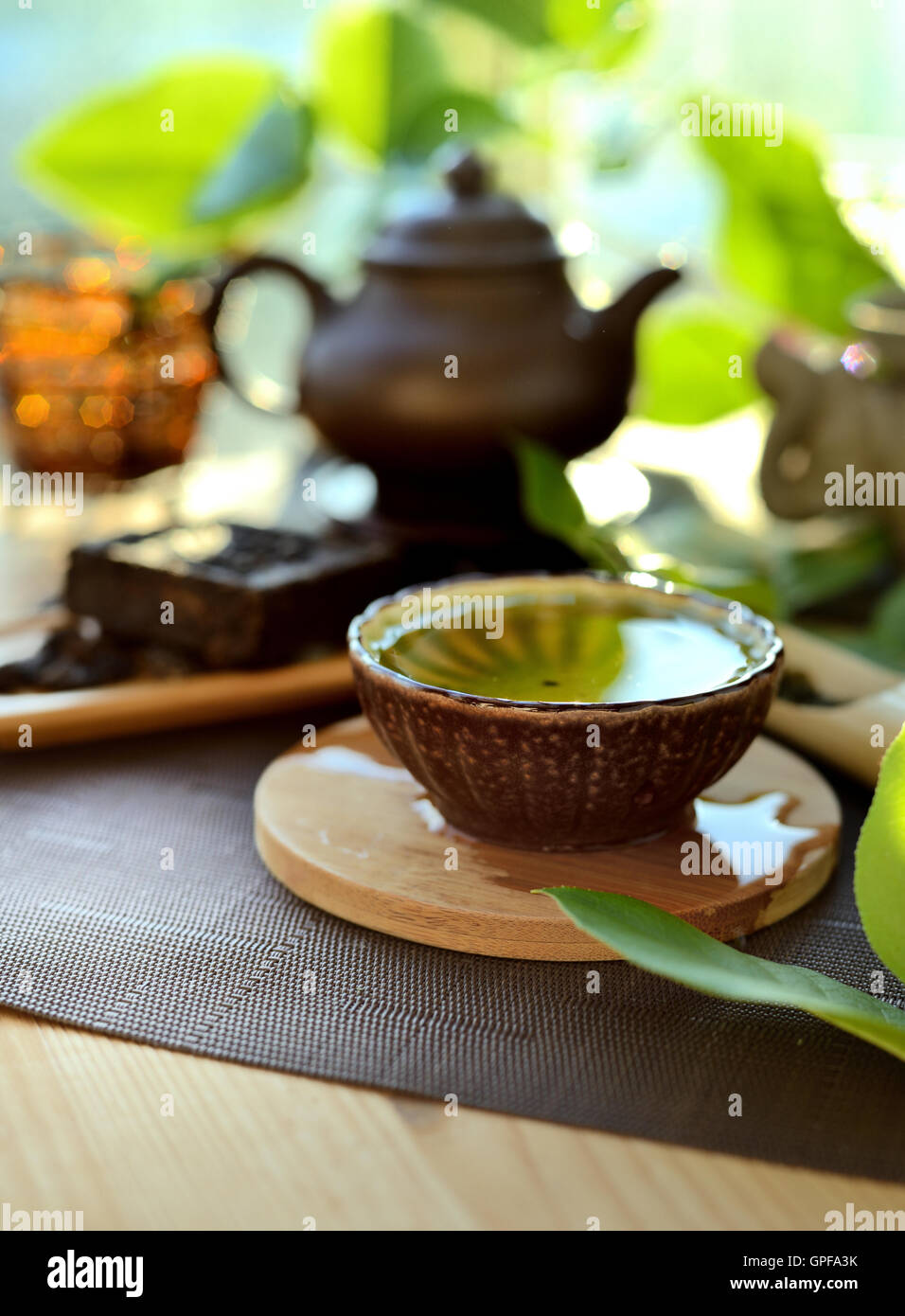 Healthy green tea cup with leaves Stock Photo - Alamy