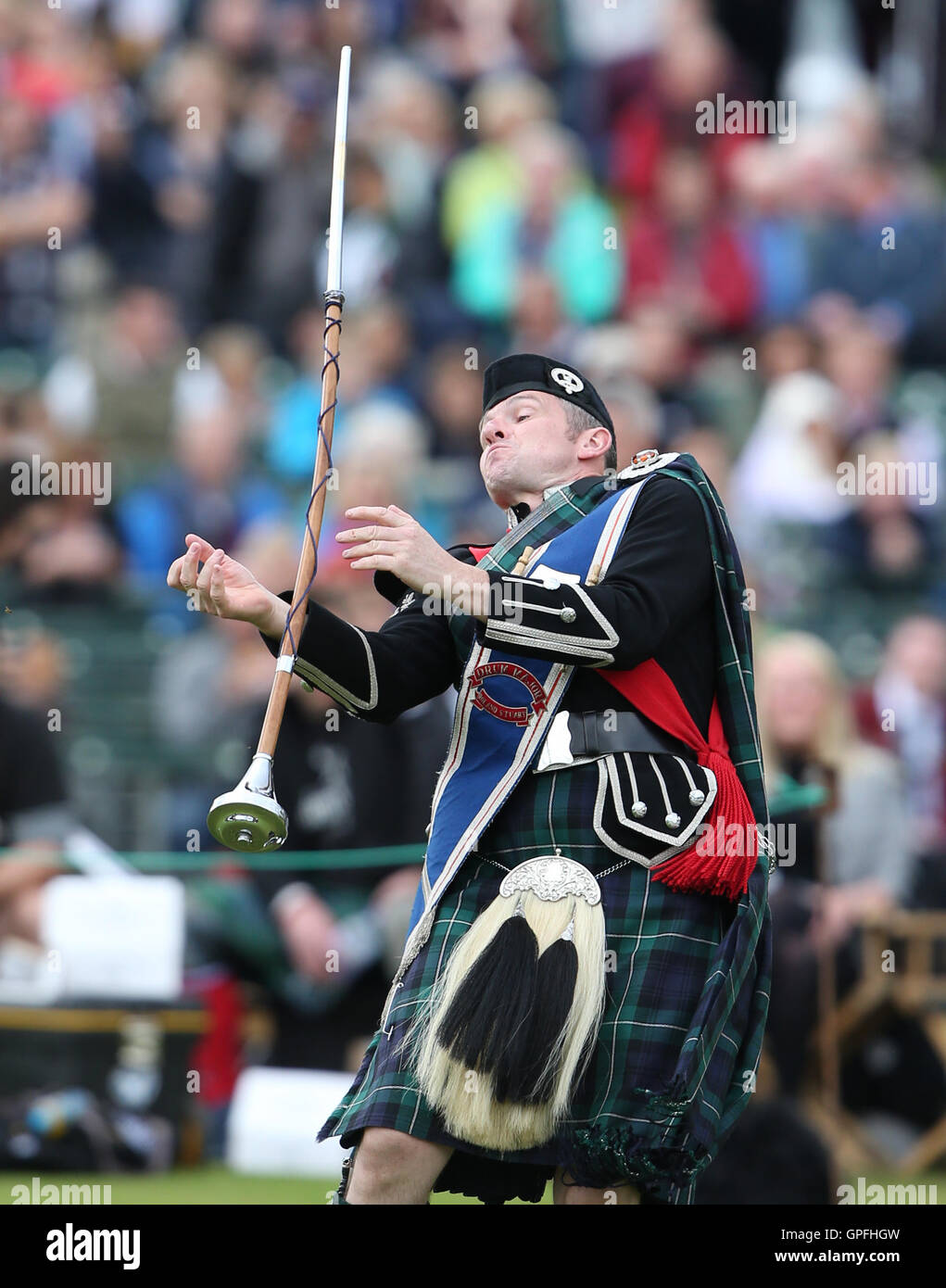 A Pipe Major attempts to catch his Mace as he takes part in the Mace ...